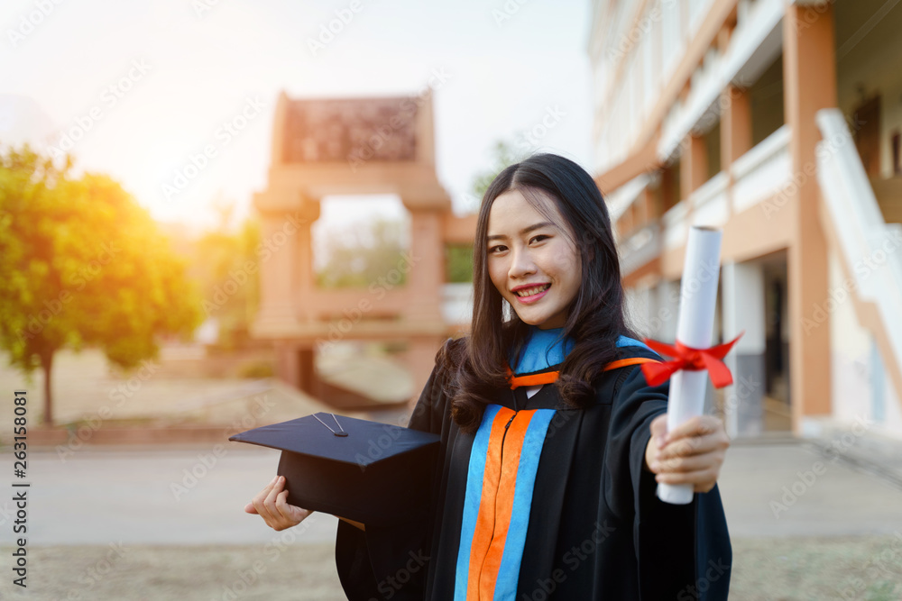 Female university graduate celebrates graduation ceremony receiving ...