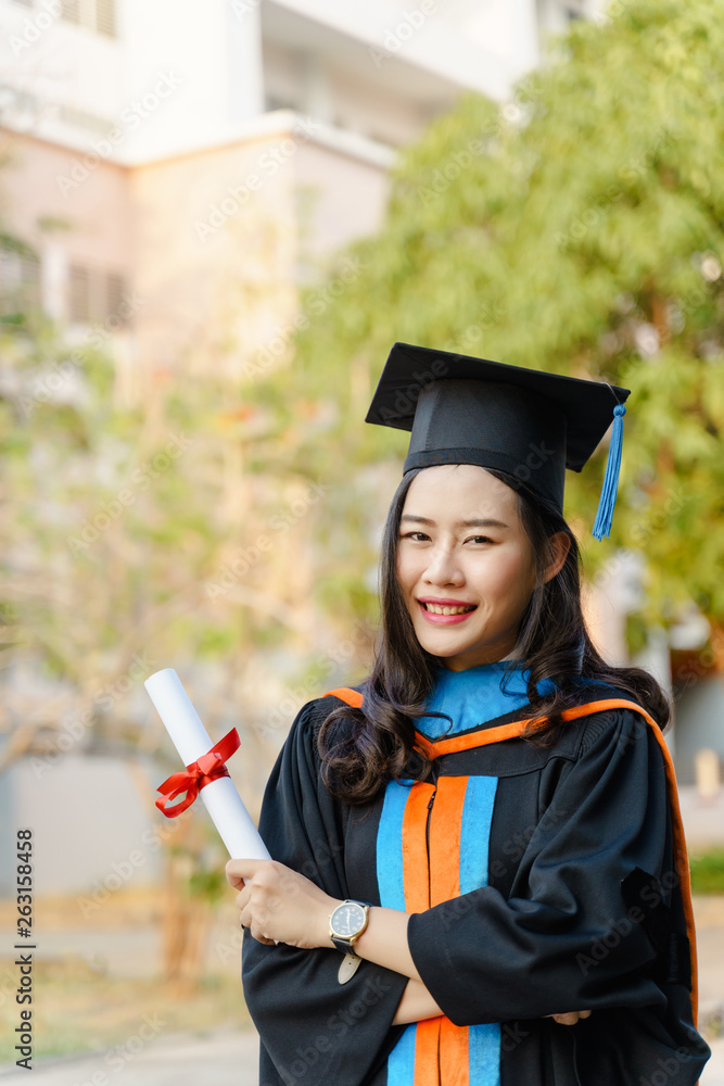 Female university graduate celebrates graduation ceremony receiving ...