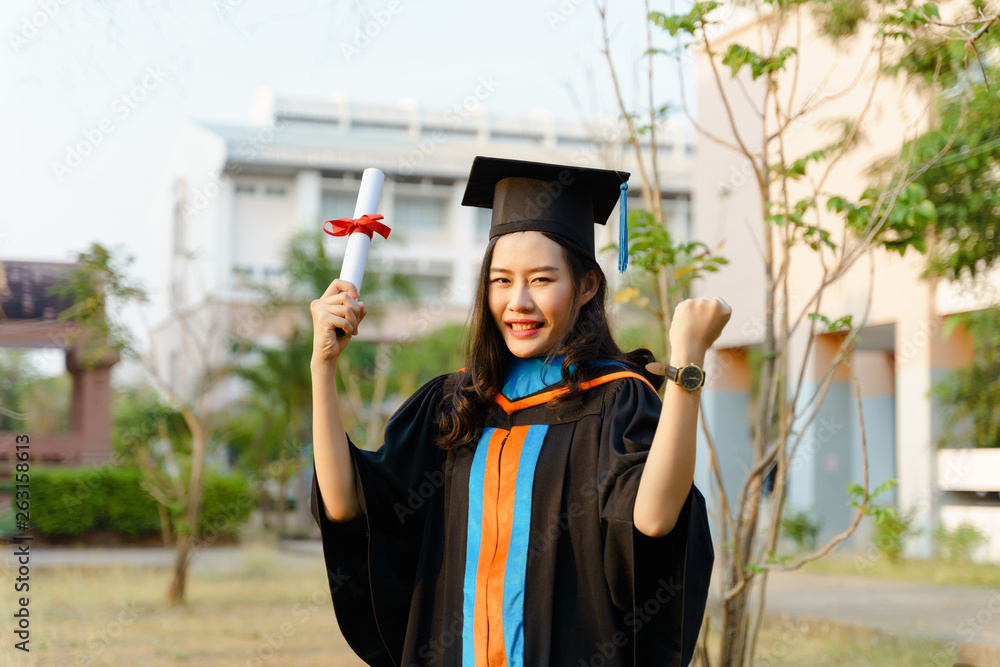 Female university graduate celebrates graduation ceremony receiving ...