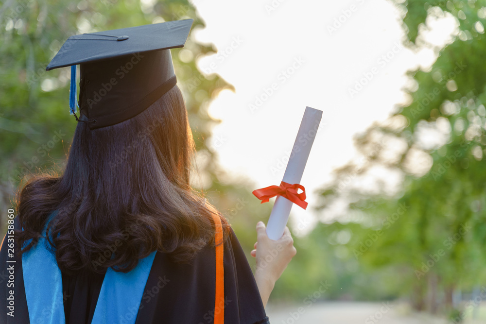 Female university graduate celebrates graduation ceremony receiving ...