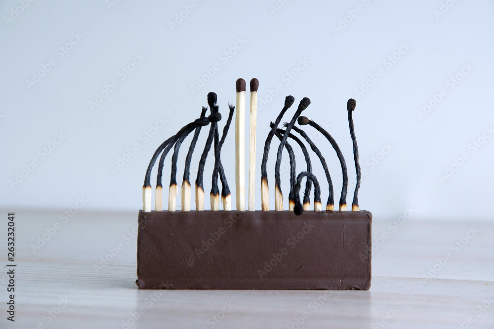 persistent guys: 2 unharmed matches sticking out among a multitude of ...