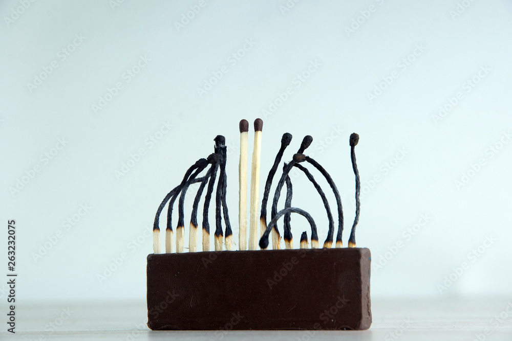 persistent guys: 2 unharmed matches sticking out among a multitude of ...