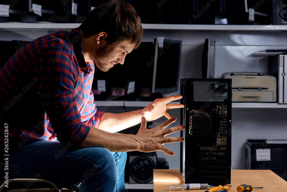 hardware problem concept.funny man using magic skills while repairing a ...