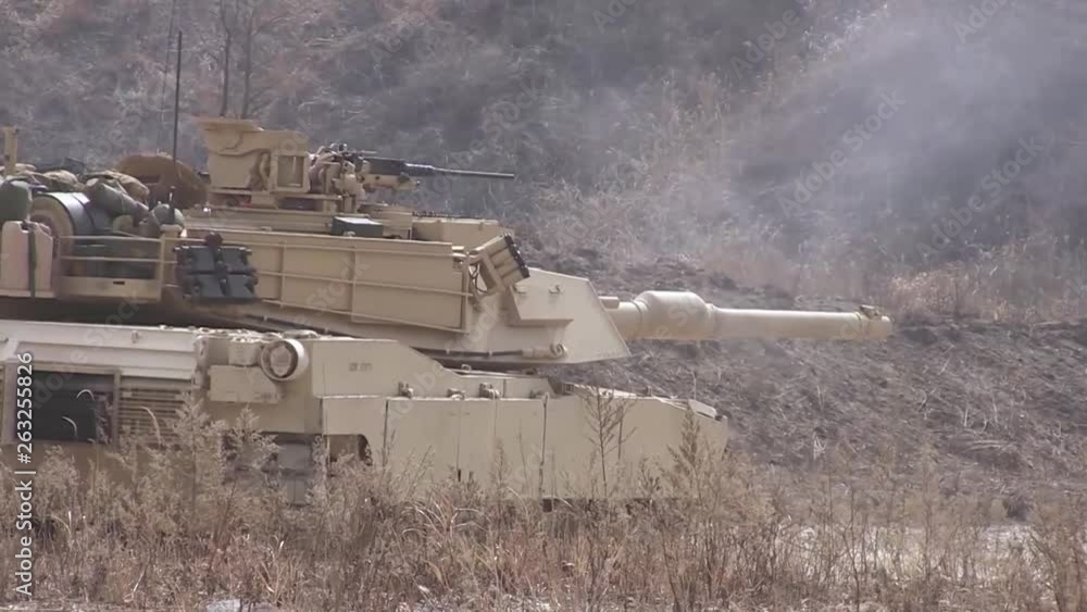 M1 Abrams tank aiming and firing machine gun Відео Stock | Adobe Stock