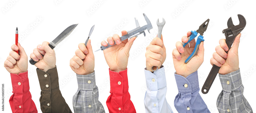 Raised male hands with different gestures and objects of the profession ...