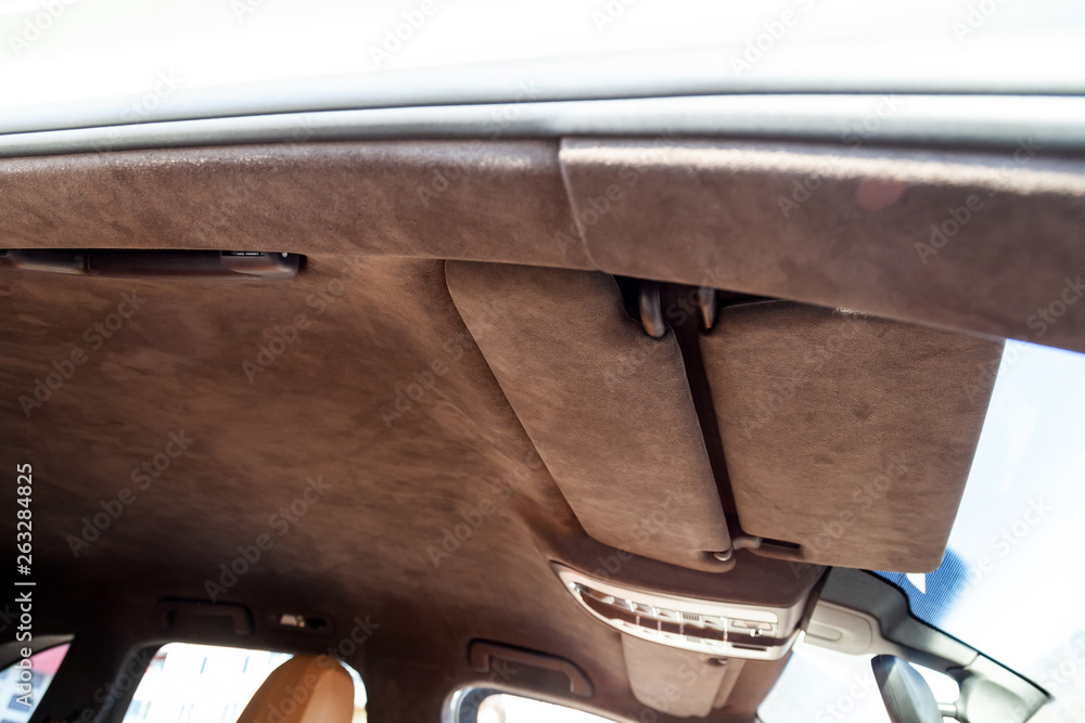 The ceiling of the SUV car pulled by brown soft material alkantara in ...