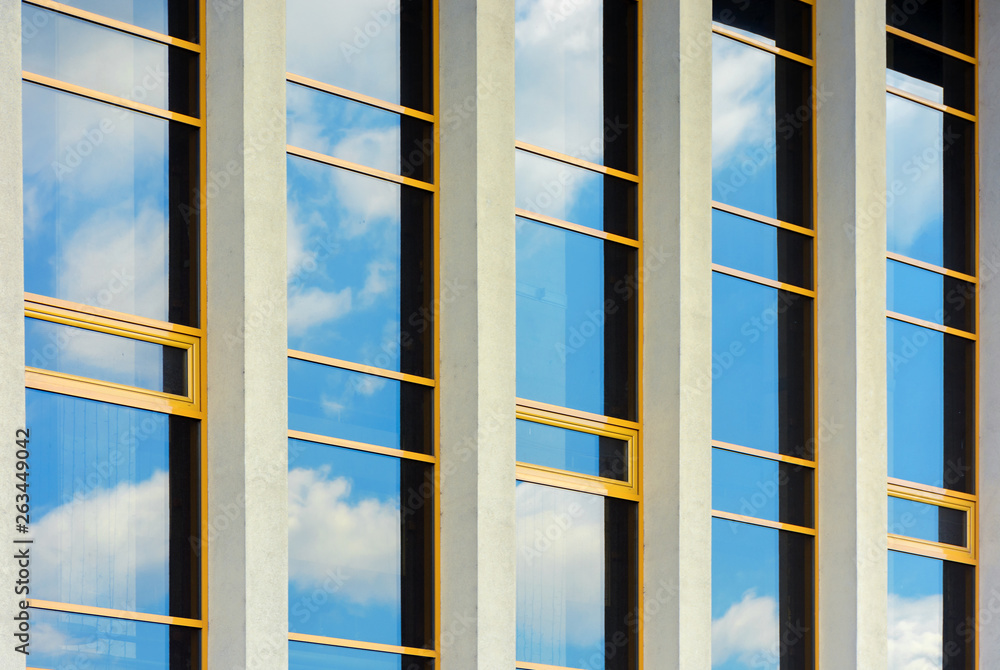 beautiful urban architecture background. window reflection of a clouds ...