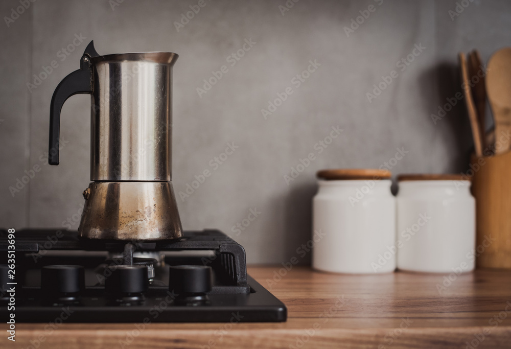 Preparing a traditional italian style coffee with coffee percolator ...