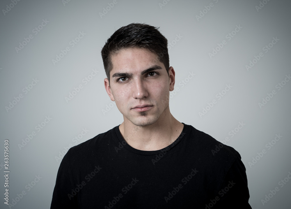 Natural portrait of young attractive man in his 20s looking and posing ...