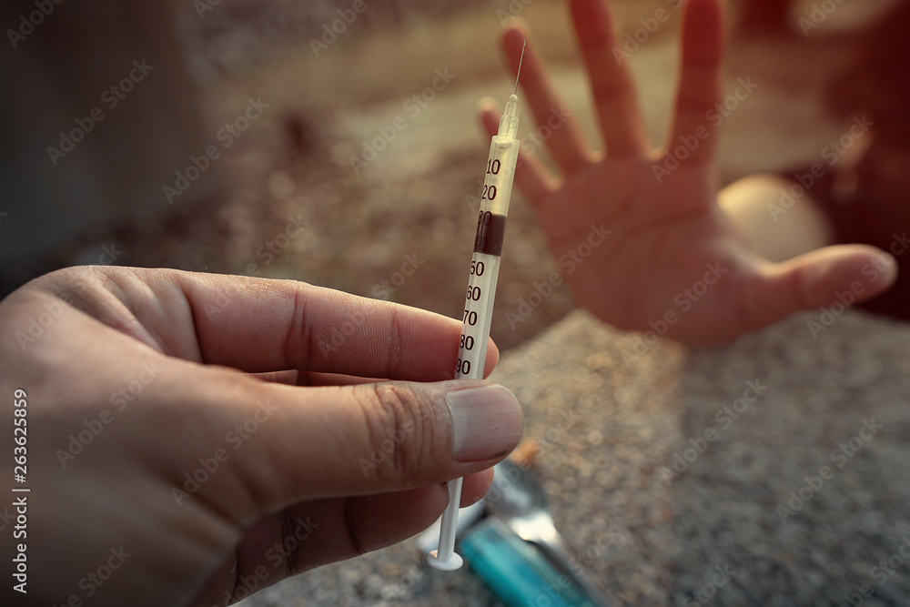 Concept: Asian man rejected drugs."International Day against Drug Abuse ...