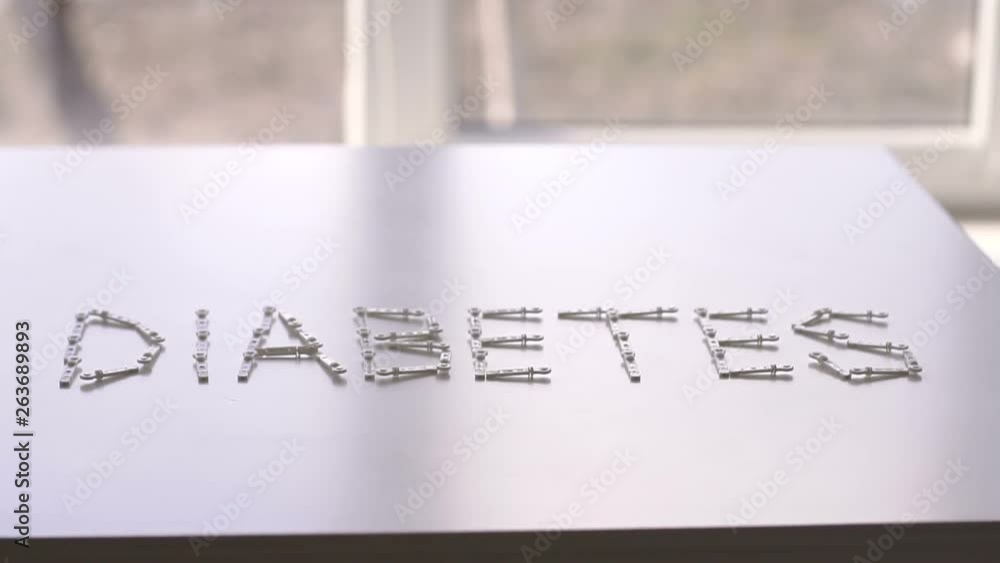 Diabetes concept. Alphabet with word DIABETES with lancets on white ...