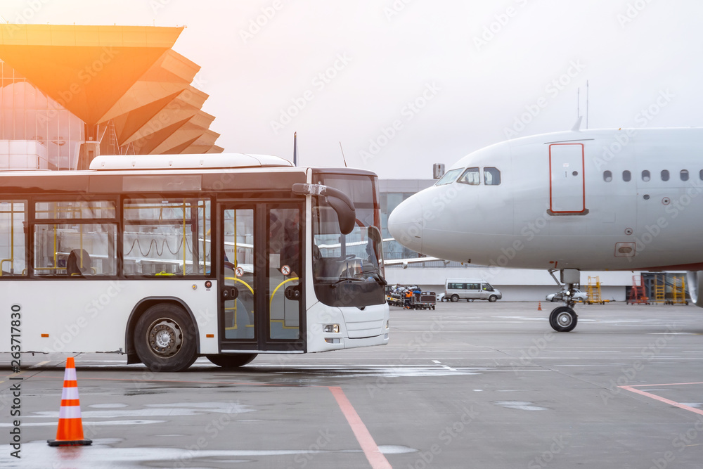 Bus to transport passengers to the aircraft, and the airplane. Nose to ...
