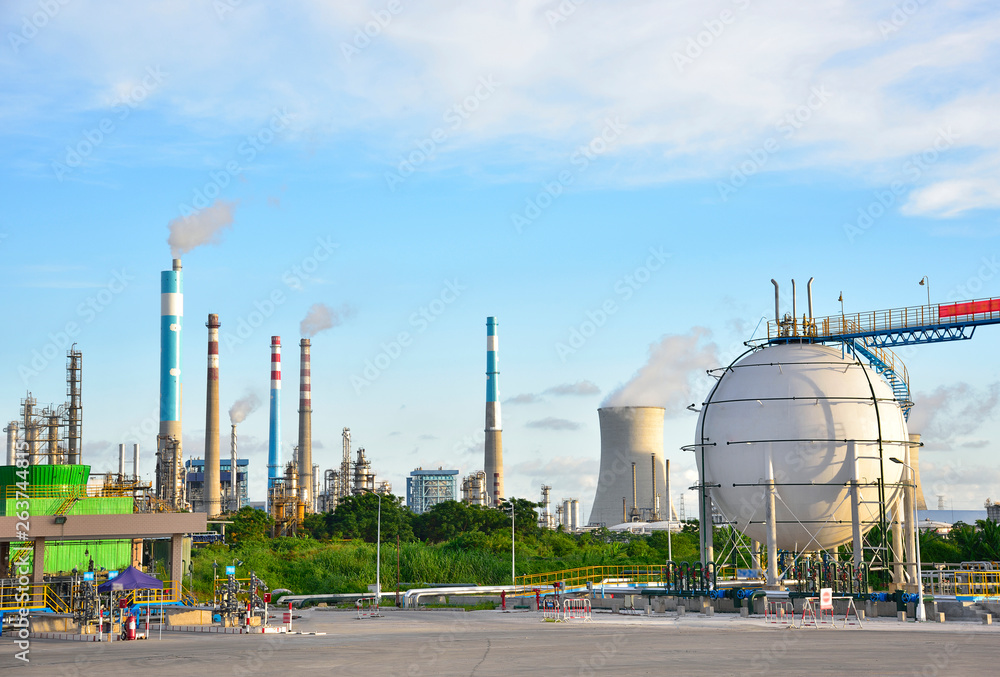 Refinery storage tanks and containers of ethanol under the blue sky ...