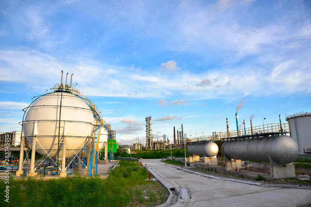 Refinery storage tanks and containers of ethanol under the blue sky ...