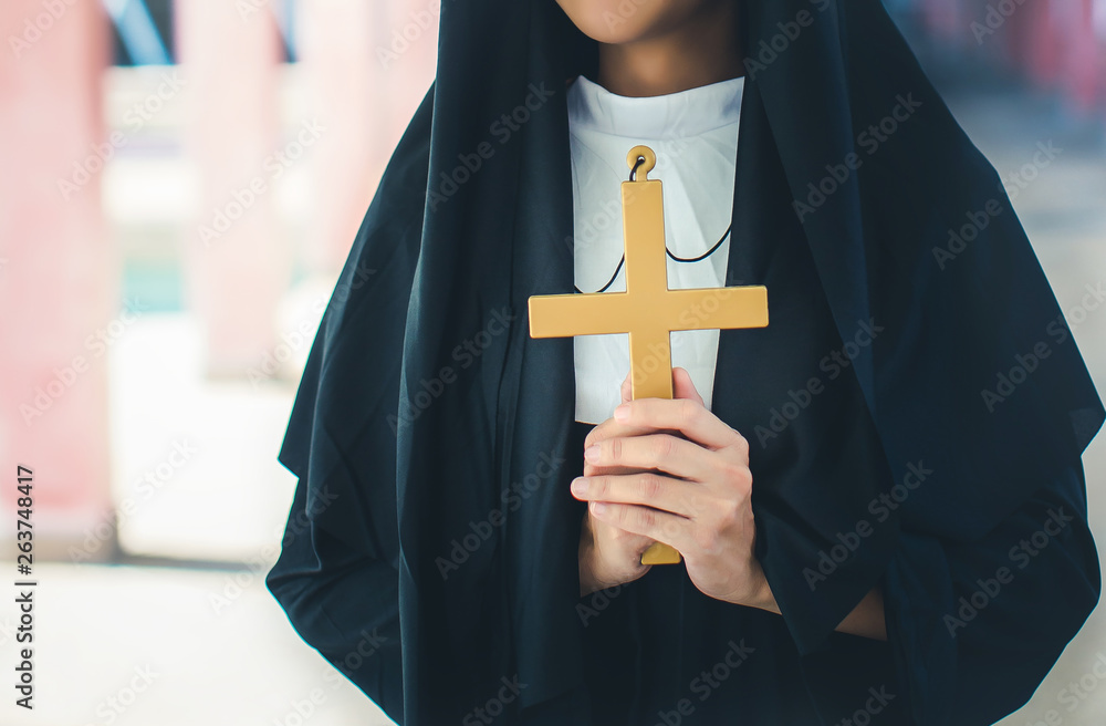 Religious Nun In Religion Concept Hands Praying To The God While Holding A Crucifix Symbol