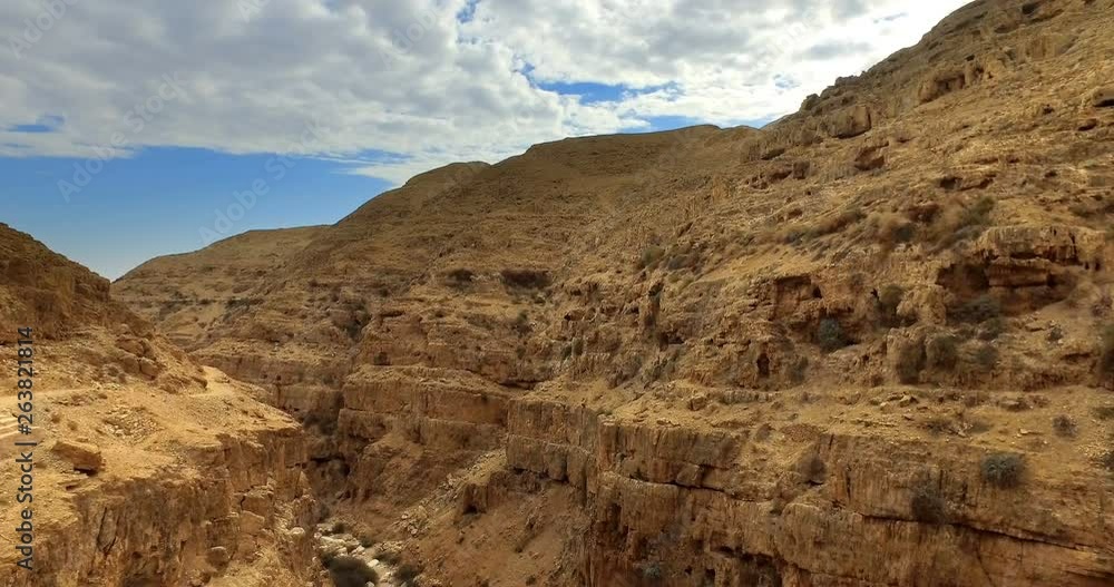 Wall of Kidron river strata canyon precipice. Panorama viewed from ...