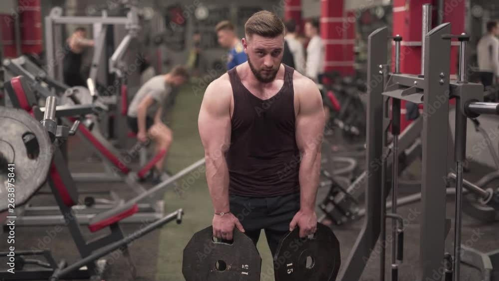 Muscular Caucasian Male Body Builder in Black Shirt Exercise Pulling Up ...