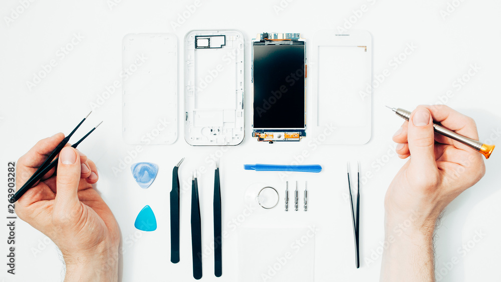 Mobile phone repair. Disassembled smartphone parts. Technician ...
