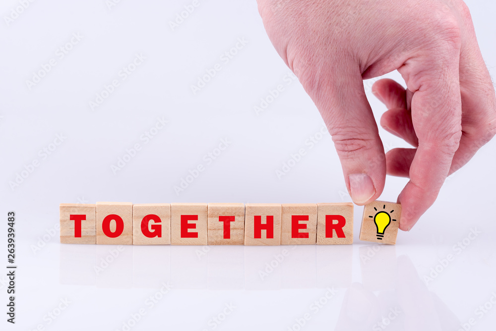 Hand puts the word together from single letters Stock Photo | Adobe Stock