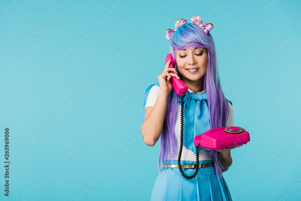 Smiling anime girl talking on telephone with closed eyes isolated on ...