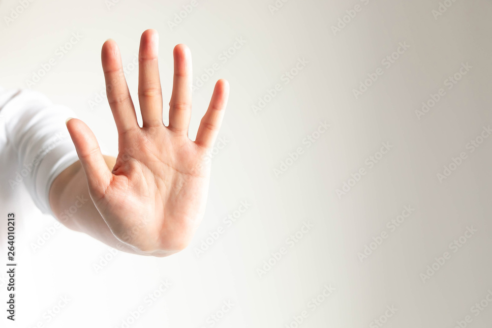 woman gesturing a hand showing five fingers meaning stop and warning to ...