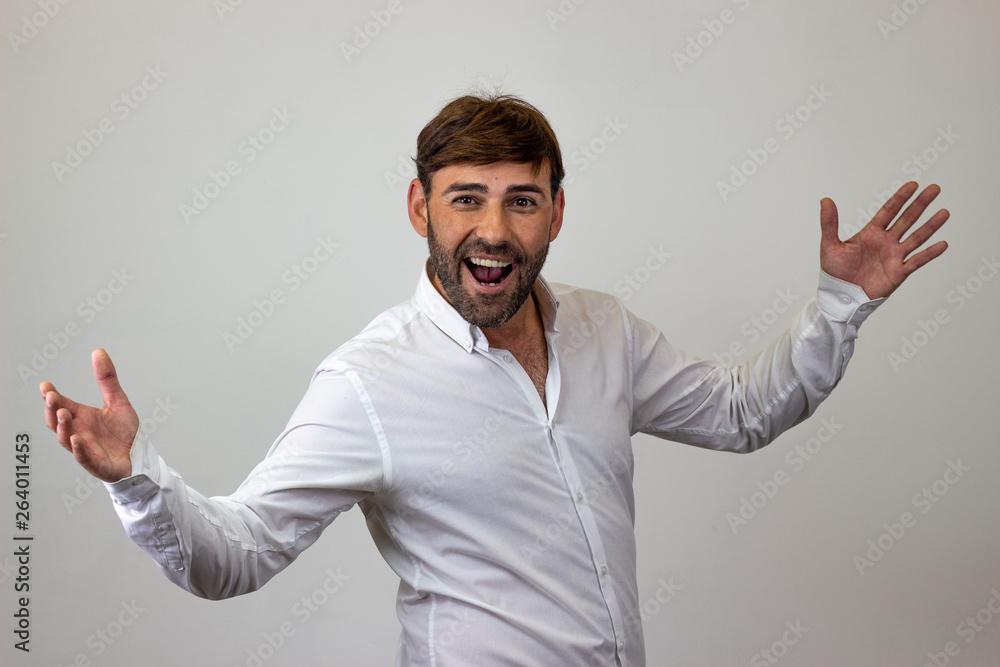 Fashion portrait of handsome young man with brown hair looking cheerful ...
