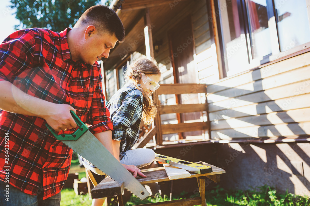 father teaching kid daughter to use tools. Girl helping dad with ...