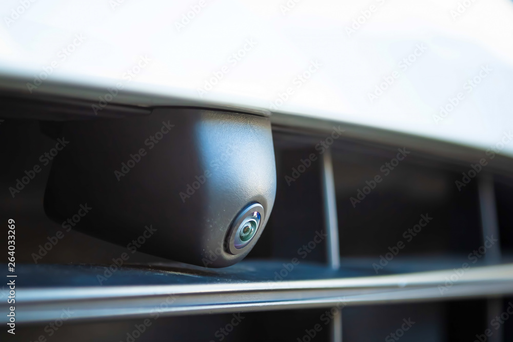 Closeup. Front view camera in the front bumper of the car. Circular 360 ...