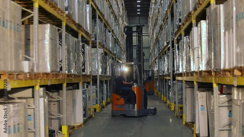 Forklift in a large modern warehouse, work of forklifts in a warehouse ...