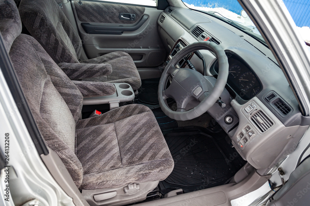 View to the gray color interior of suv car with front seats, steering ...