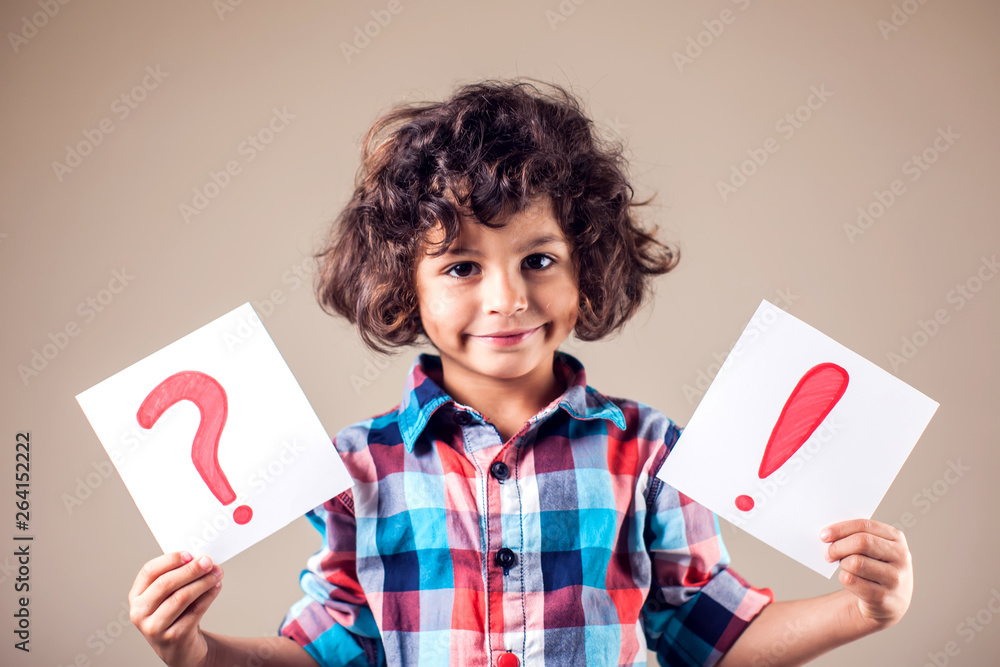 Thinking kid boy with question and exclamation signs Stock Photo ...