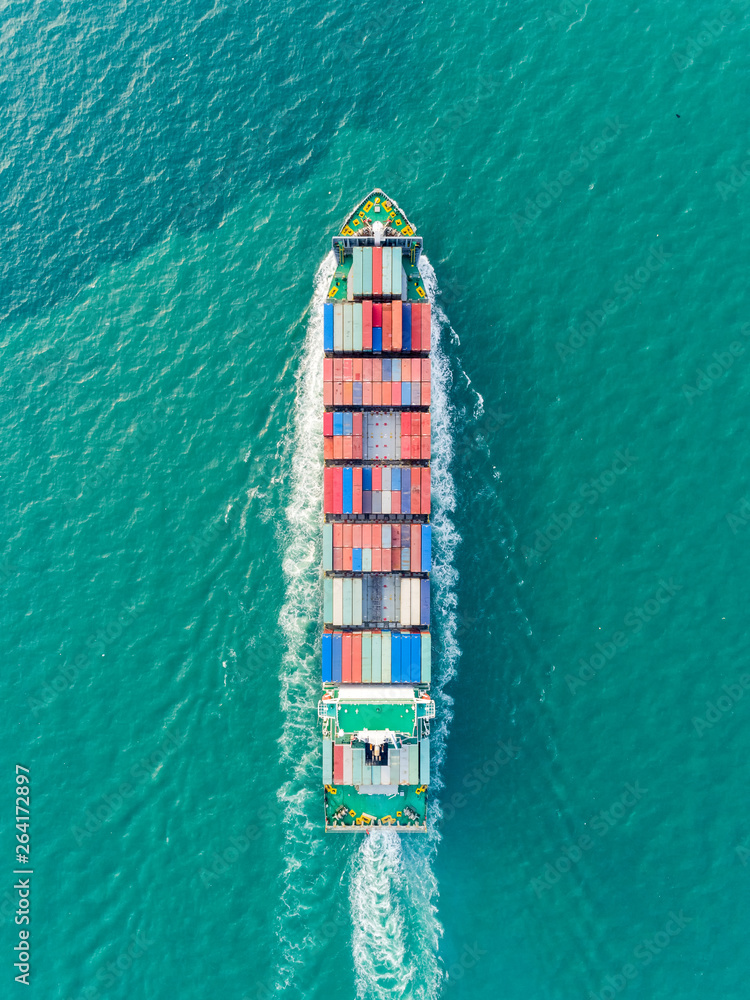 Aerial top view container ship on the seaa full speed delivering ...