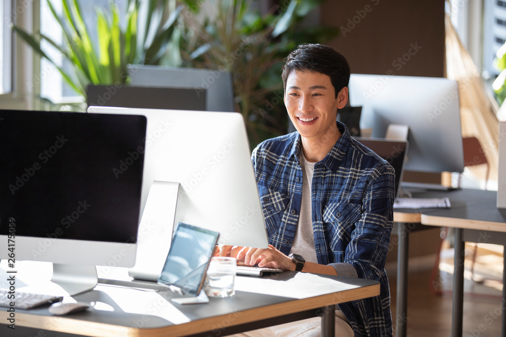 Young college student using computer Stock Photo | Adobe Stock