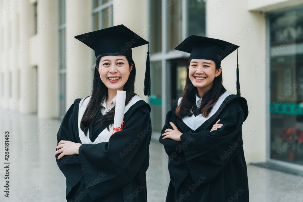 Young asian women students wearing graduation cap and uniform happy face smiling with crossed ...