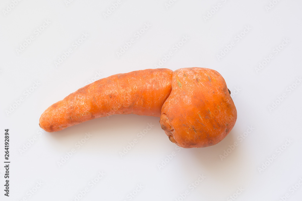 Trendy organic ugly carrot on white background. Misshapen produce ...