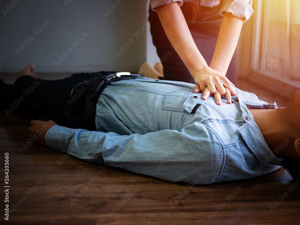 volunteer office woman use hand pump on chest for first aid emergency ...