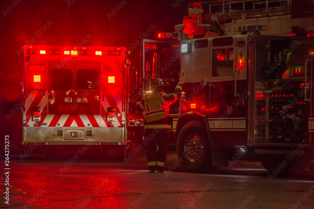 fire truck, firefighter, ambulance responding to car crash at night ...