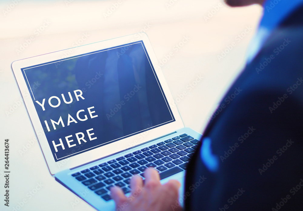 Person Using Laptop on Street Mockup Stock Template | Adobe Stock