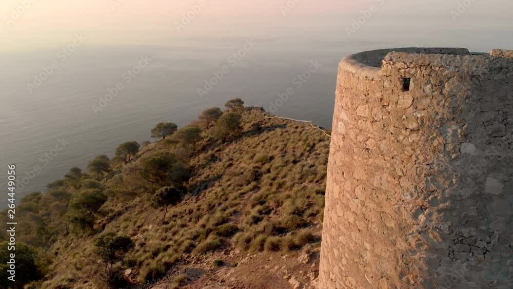 Stockvideon Backwards aerial pan moving closely past Vigía De Cerro ...