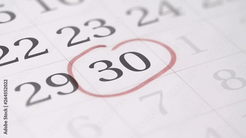Marking the thirtieth 30 day of a month in the calendar with a red ...