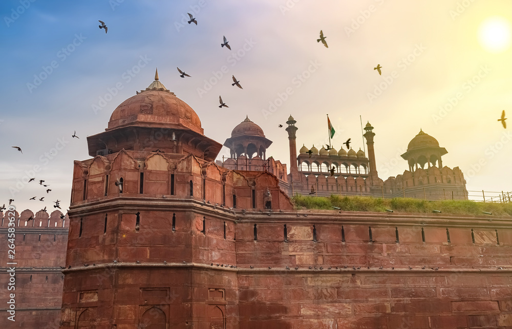 Red Fort Delhi at sunrise with birds flying. Red Fort is a medieval ...
