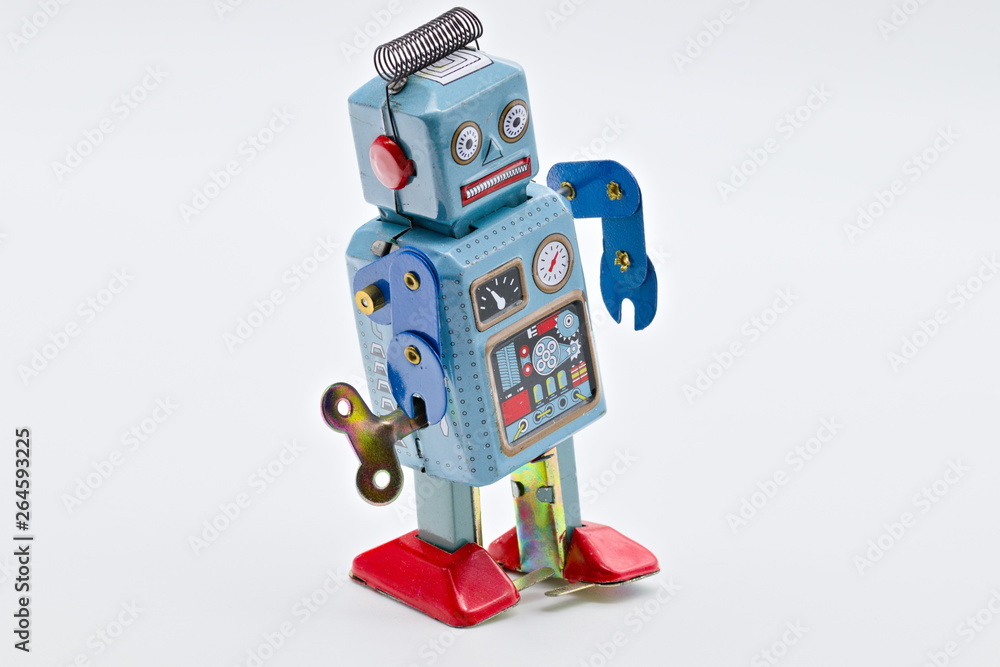 Grey vintage old wind up toy robot isolated on white limbo background ...