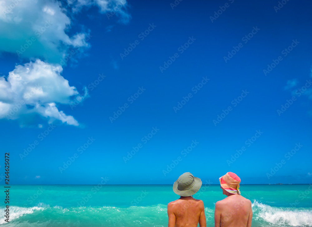 Two Topless Women On Caribbean Beach At Hawksbill Bay Antigua