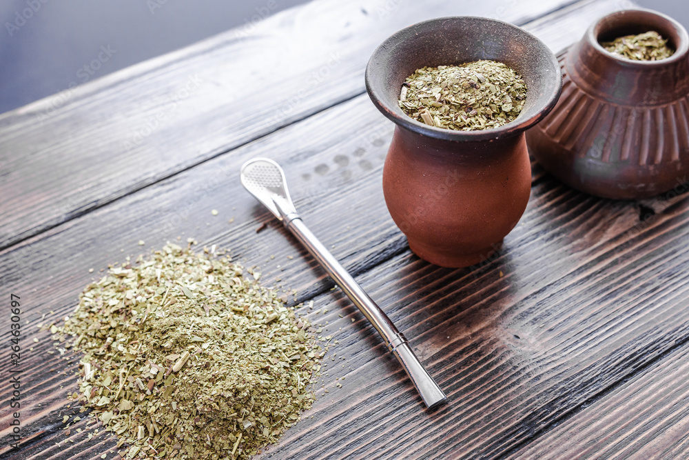 A yerba mate tea set of calabash gourds, ceramic cup, bombilla metal ...