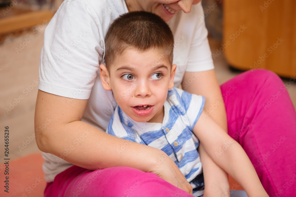 little kid with cerebral palsy has musculoskeletal therapy by doing ...