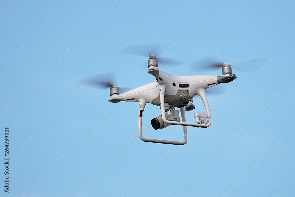 Phantom 4 Pro drone in flight. Drone with damage from falls and radio ...