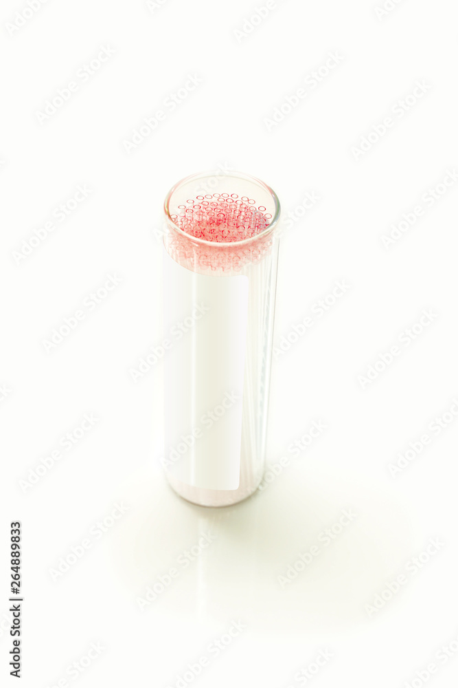 Medical capillary glass tube in container on white background with ...