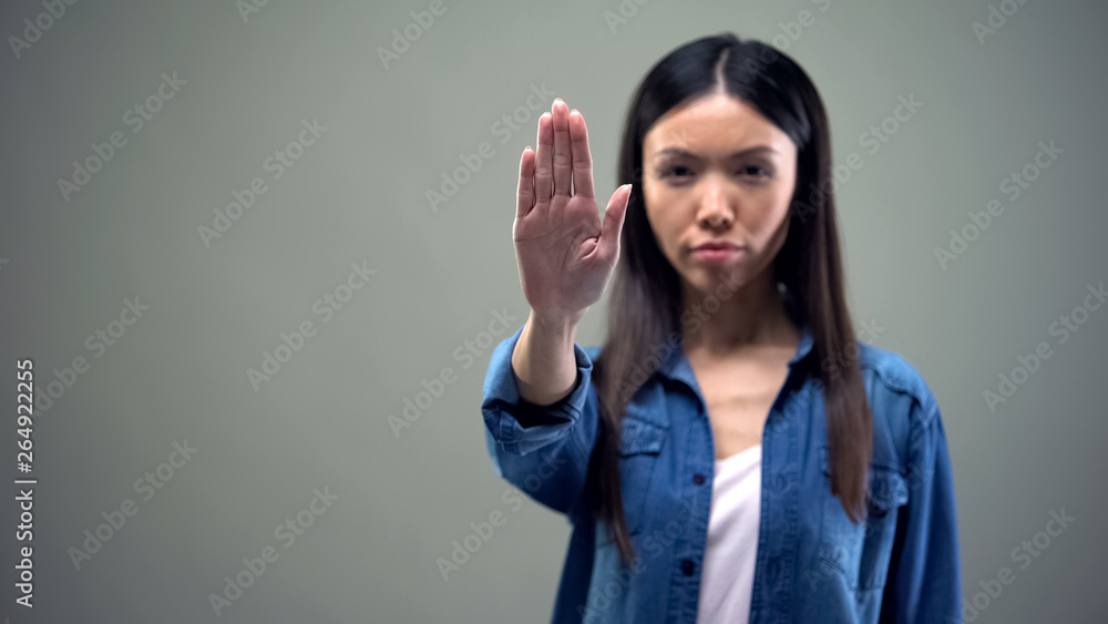 Lady showing stop sign, fighting against racial and gender ...