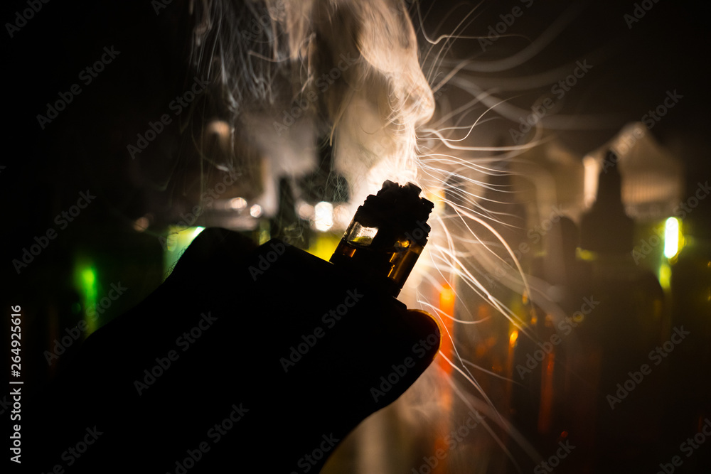 Vape concept. Electronic Cigarette vape explosion. Smoke clouds and ...
