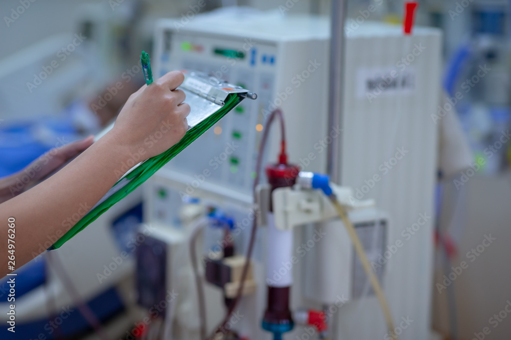 Dialysis nurse are checking dialysis machine before hemodialysis ...